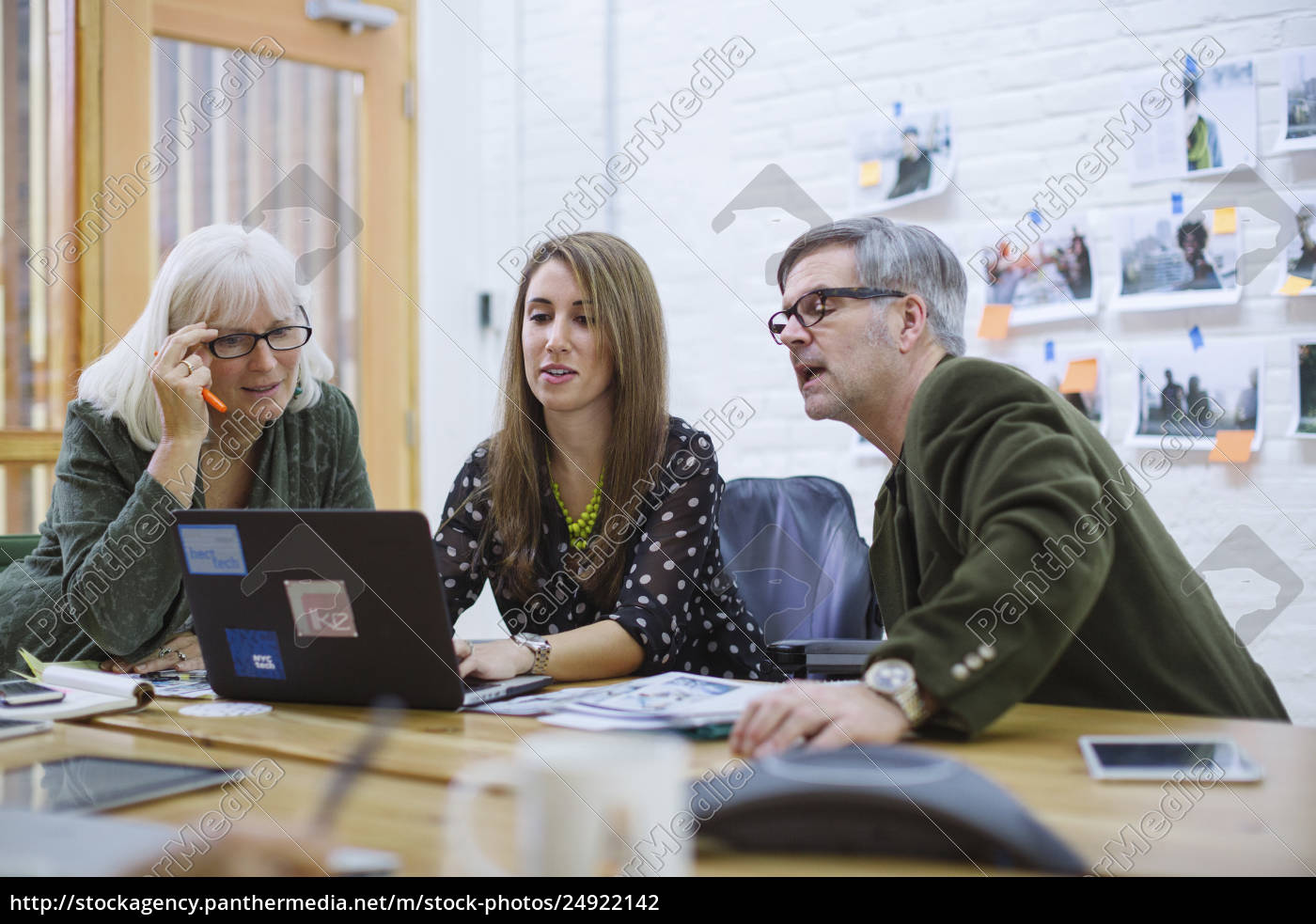 Business people doing research on laptop computer in - Stock Photo ... Business people doing research on laptop computer in - Stock Photo ...